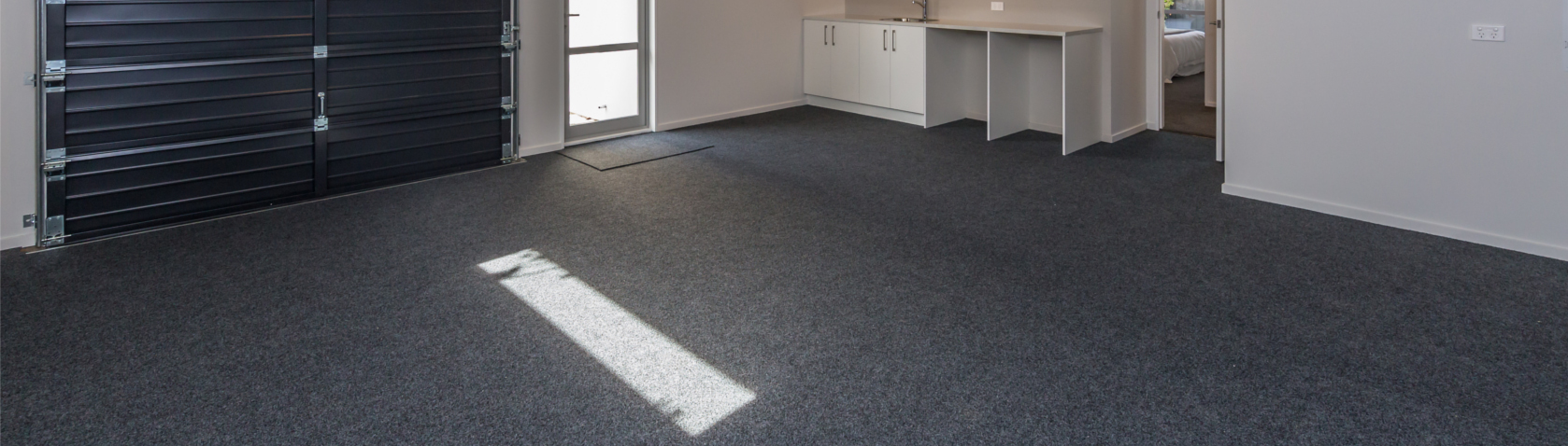 Garage, outdoor and acoustic carpeting solutions - Dominion Flooring